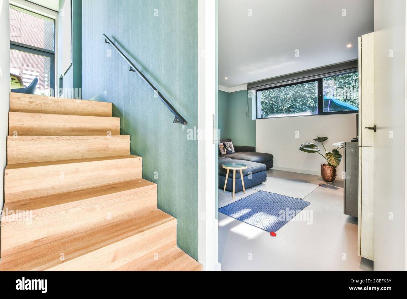 Modern apartment interior with a staircase leading to the second floor ...