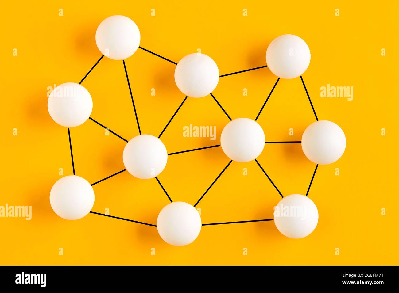 Balls connected to each other representing a network structure ...