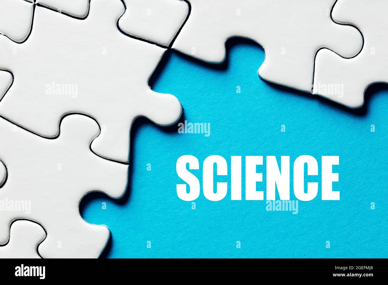 The word science on blue background surrounded by puzzle pieces ...