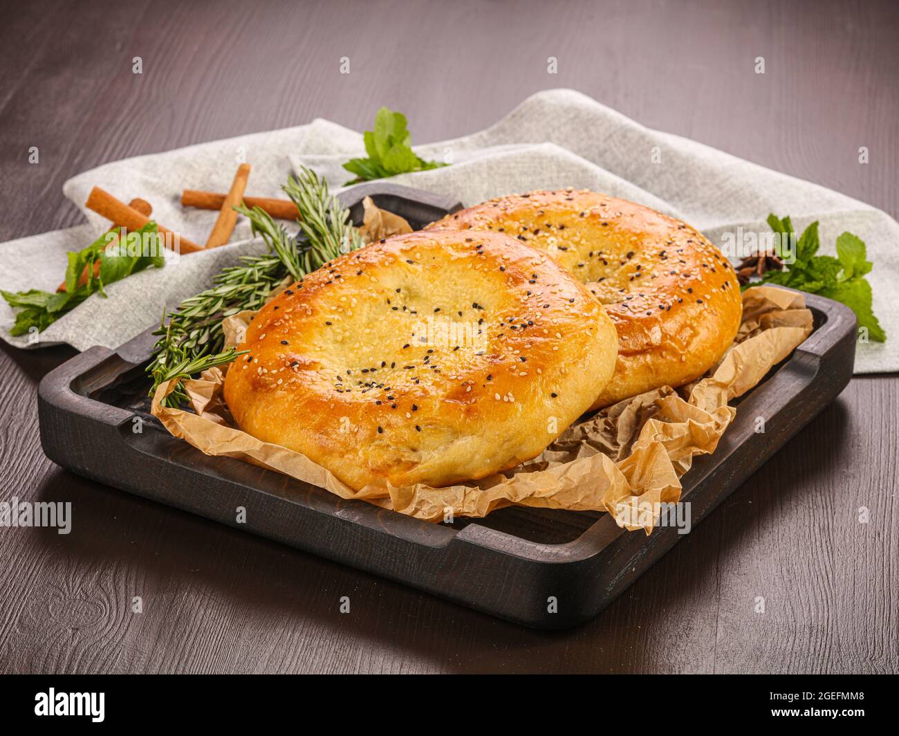 Traditional Uzbek round bread homemade bakery Stock Photo - Alamy