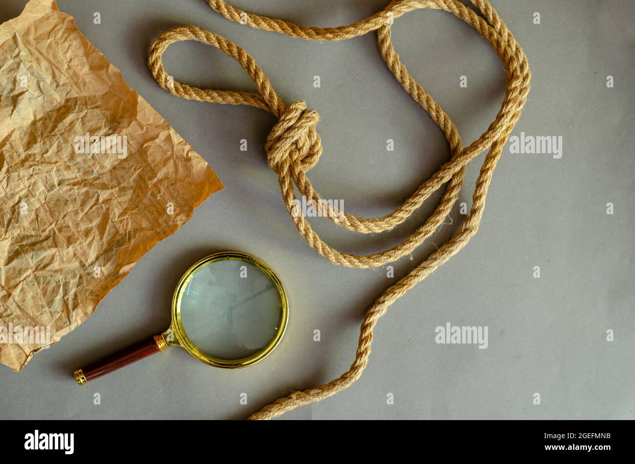 Rope against a gray background. Magnifying glass. Natural rope ...