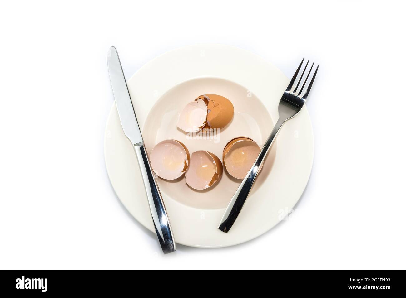 Shell egg on a plate isolated on white background Stock Photo - Alamy