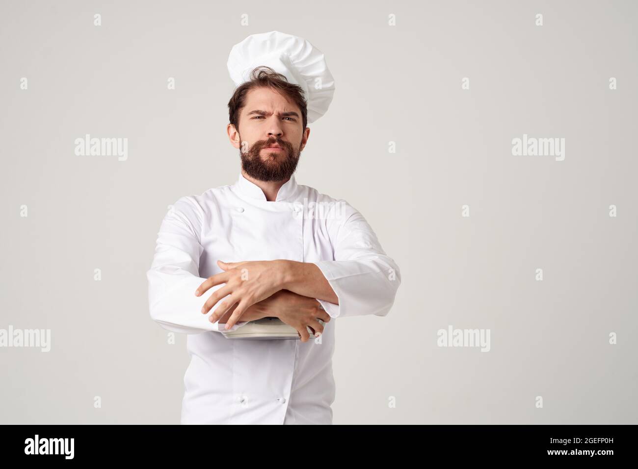 emotional male chef with a saucepan in his hands dissatisfaction ...