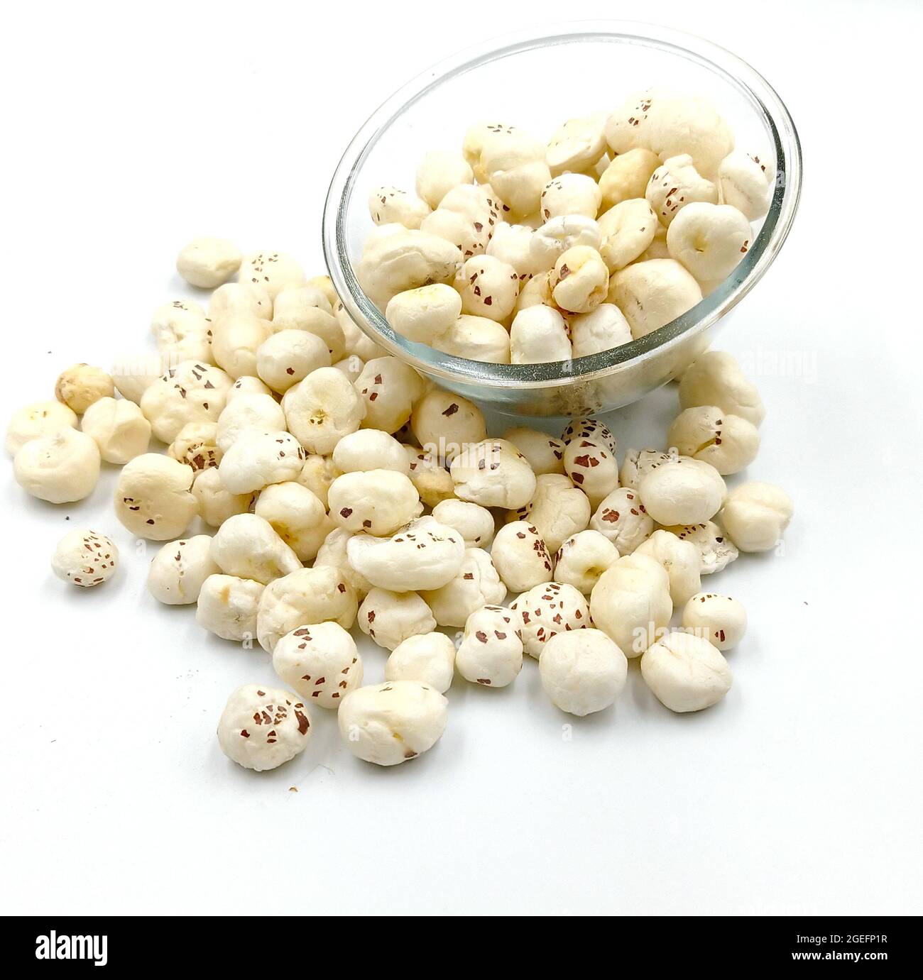 Closeup shot of crispy lotus pops seeds served in a glass bowl on a ...