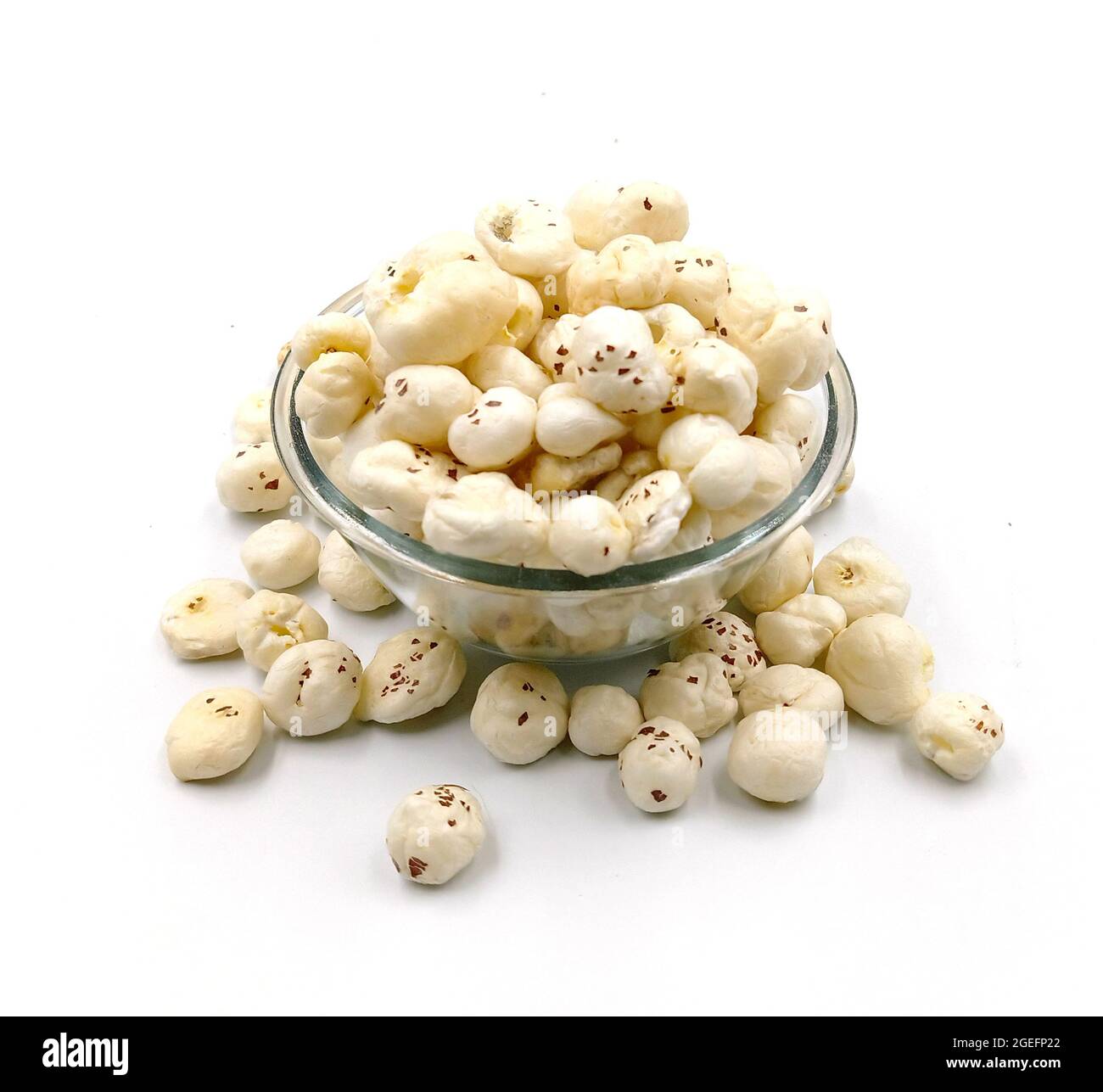 Closeup shot of crispy lotus pops seeds served in a glass bowl on a ...