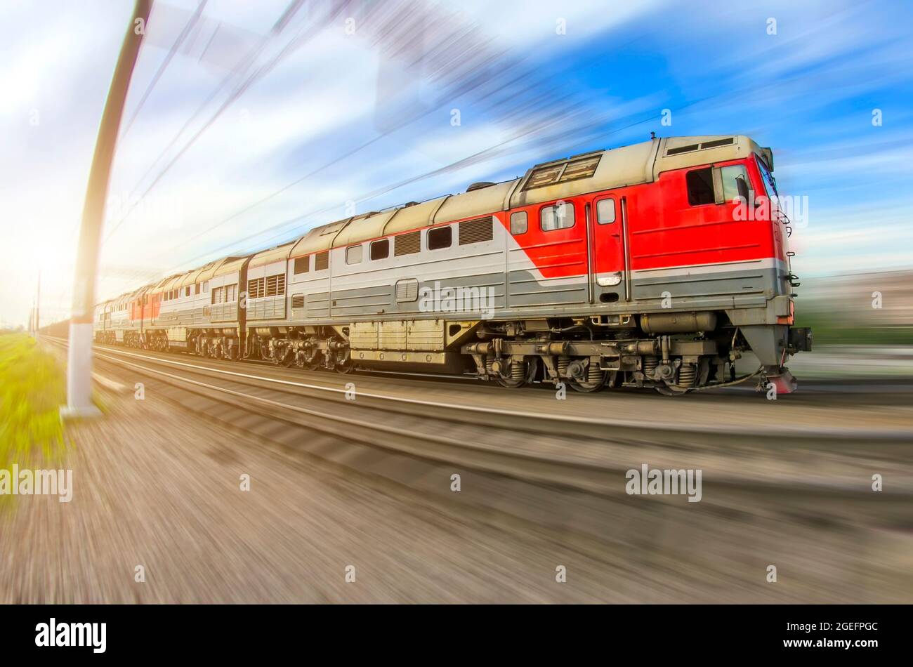 Freight train long locomotive rides speed railway Stock Photo - Alamy