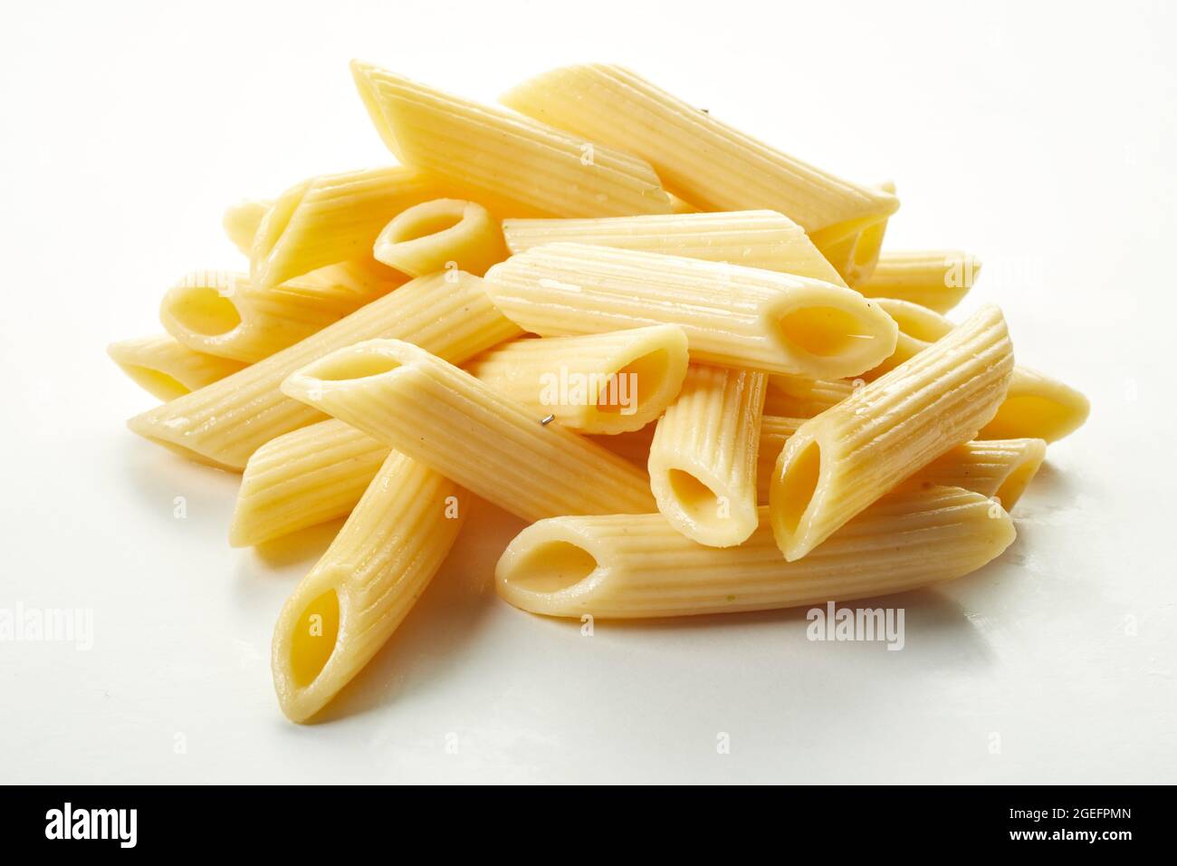 Closeup pile of delicious penne pasta for a traditional Italian meal on ...