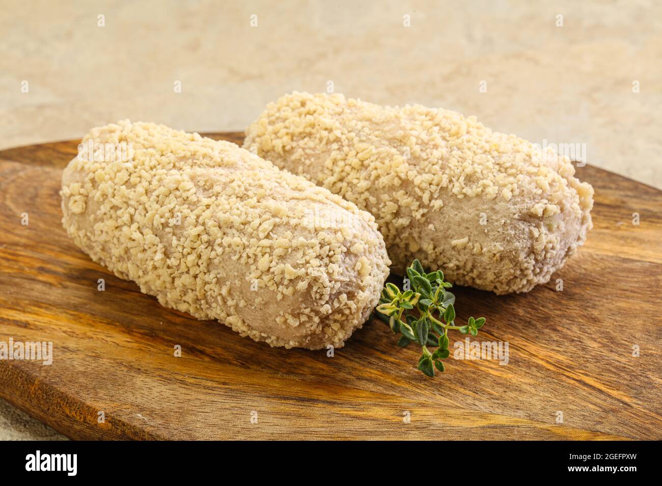Raw breaded chicken cutlet for roast Stock Photo - Alamy