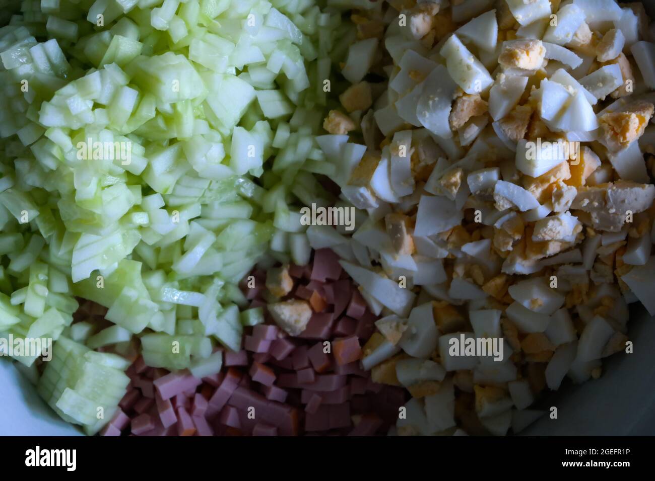 Closeup of chopped cucumber, boiled eggs, and ham sausage Stock Photo ...