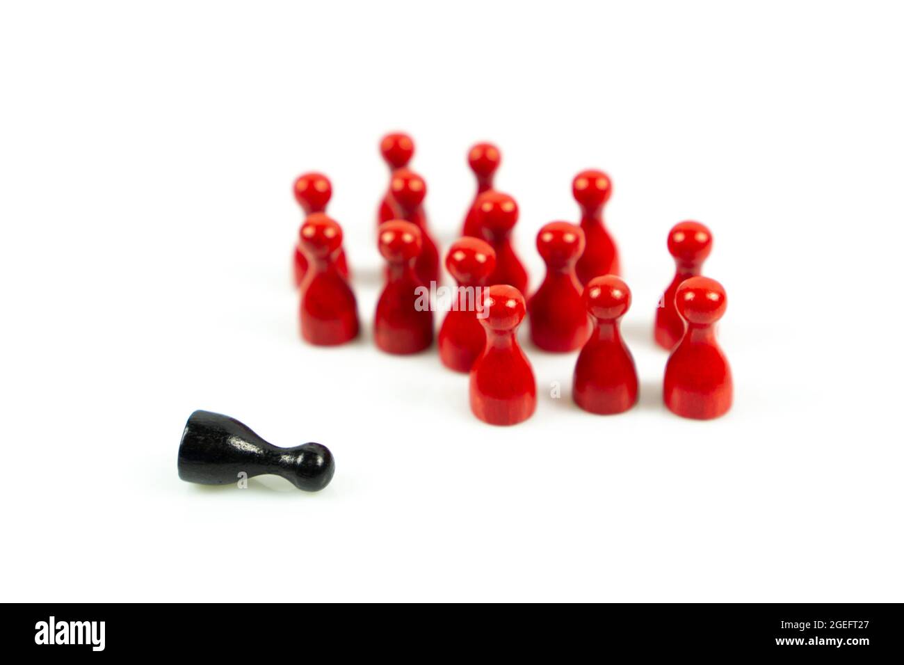 Single black pawn with red pawns isolated on white background Stock ...