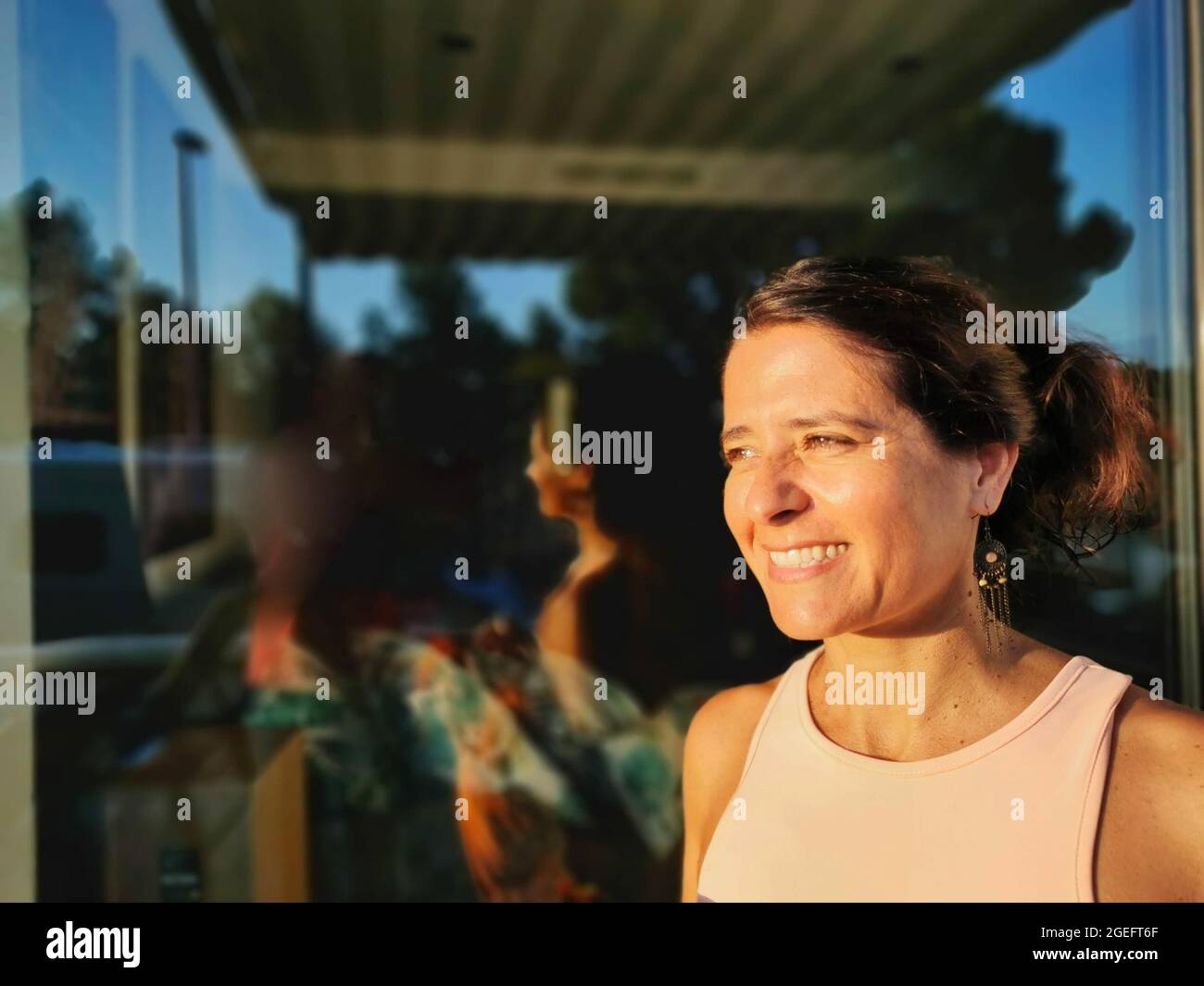 Hispanic woman from Spain outside in the yard Stock Photo - Alamy