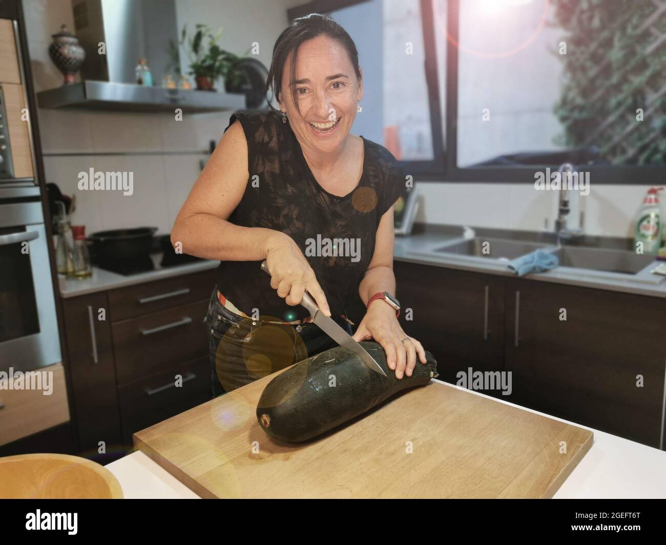 Hispanic woman from Spain cooking in the kitchen Stock Photo - Alamy