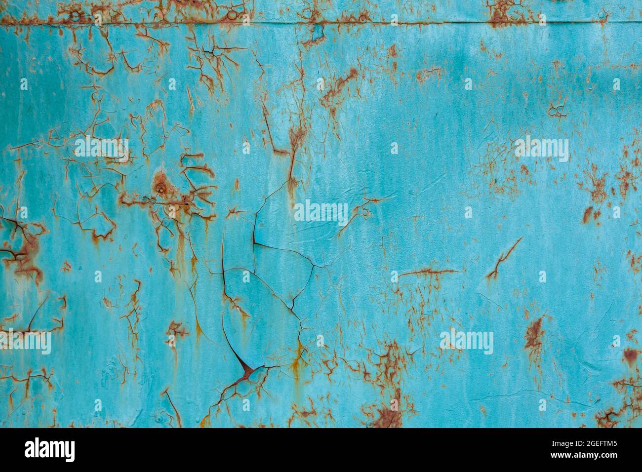 turquoise painted flat steel sheet with cracks and rust stains Stock ...