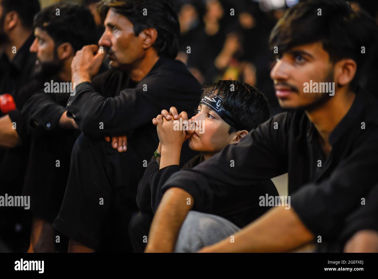 Kashmiri Shia mourners are seen during the Ashura procession in ...