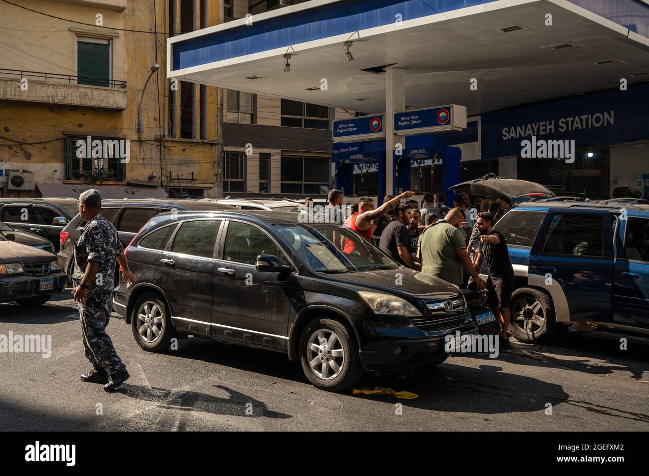 Chaos and soldiers as hundreds of Lebanese wait in line for fuel at a ...