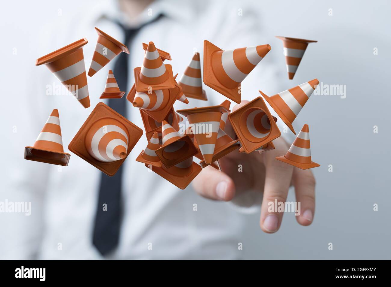 Person's hand reaching to 3D rendered traffic cones Stock Photo - Alamy