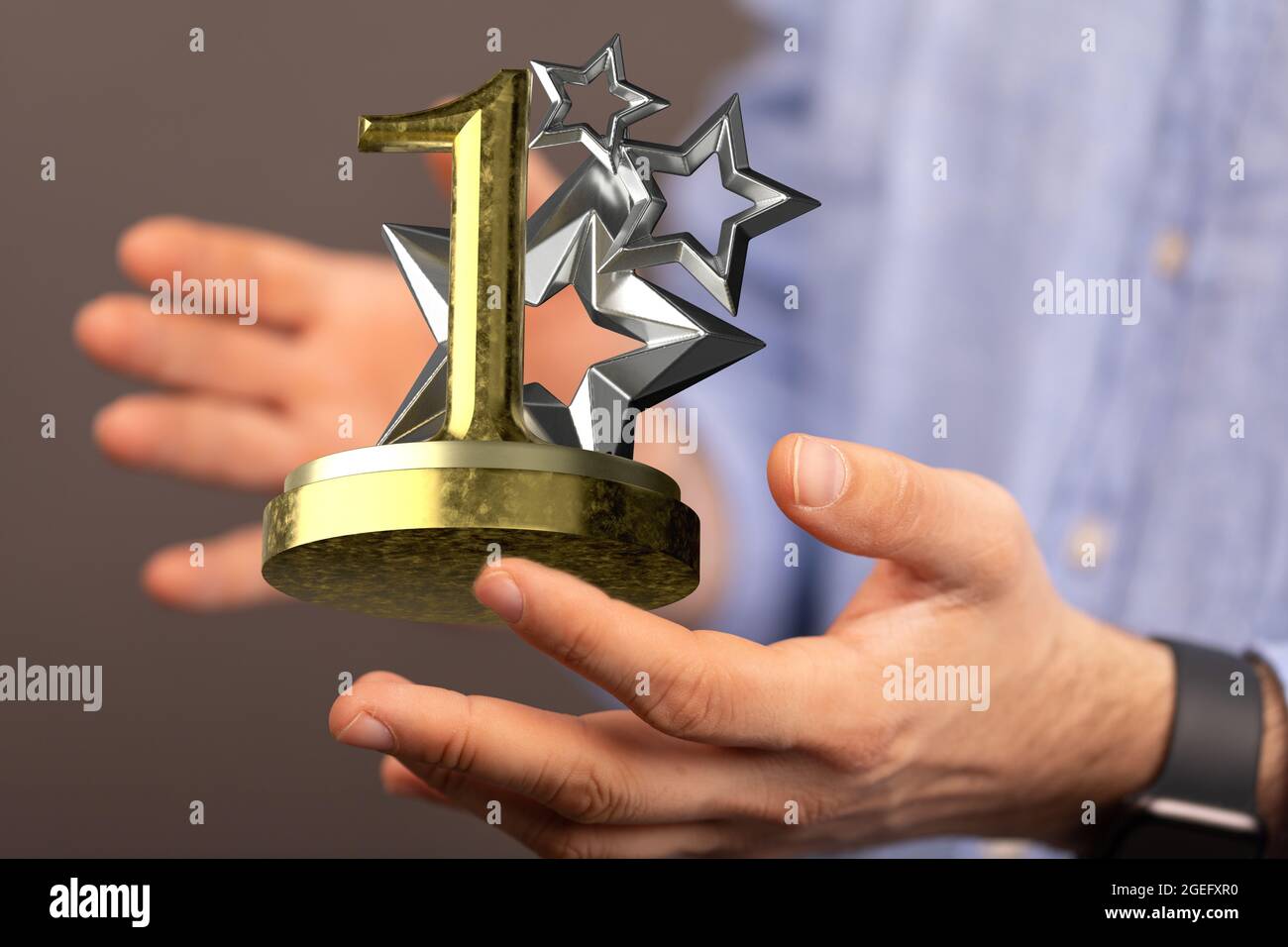 Hand holding a 3D render of a first place trophy Stock Photo - Alamy