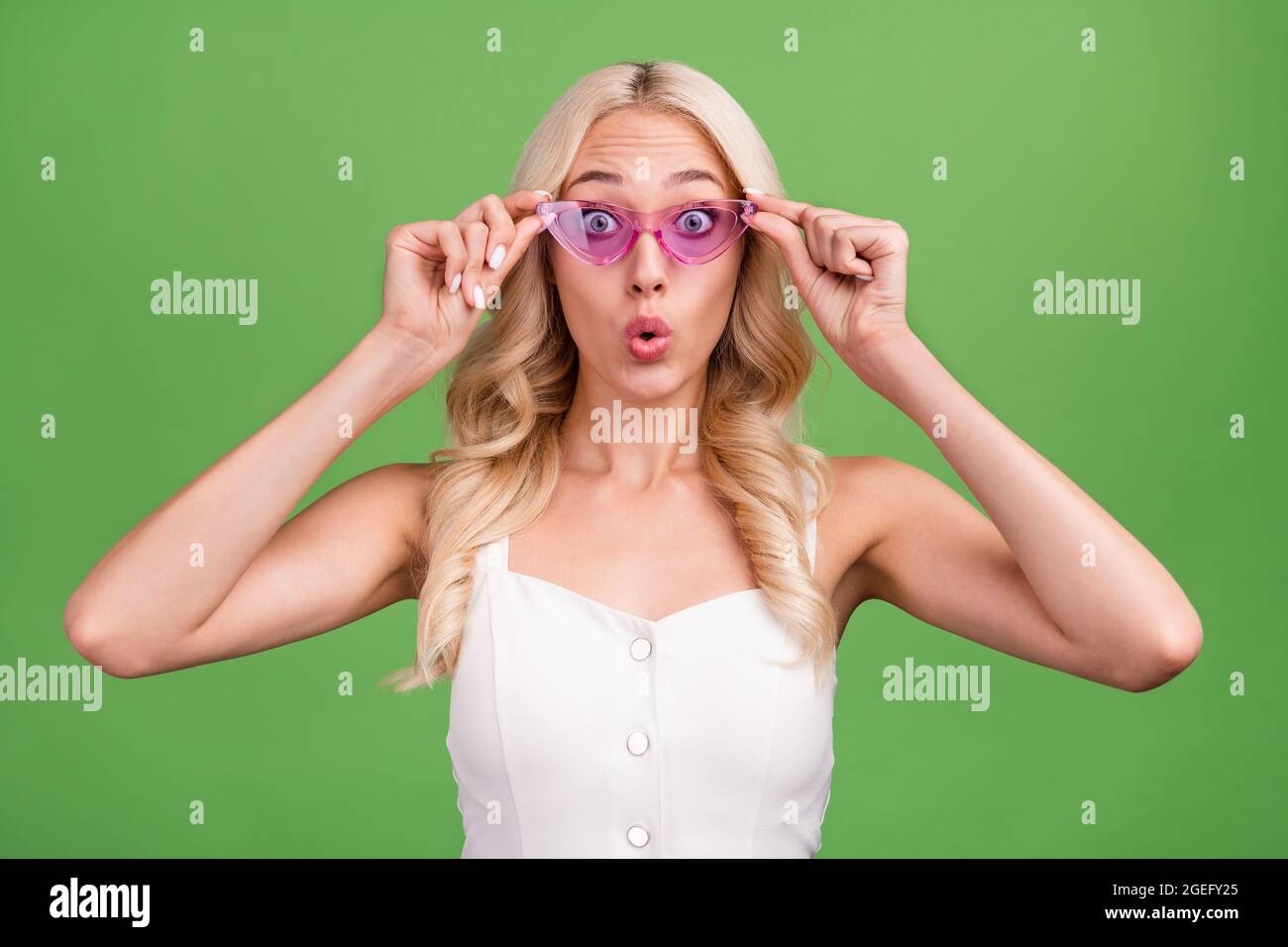Photo of young shocked amazed girl in pink glasses see huge sale ...