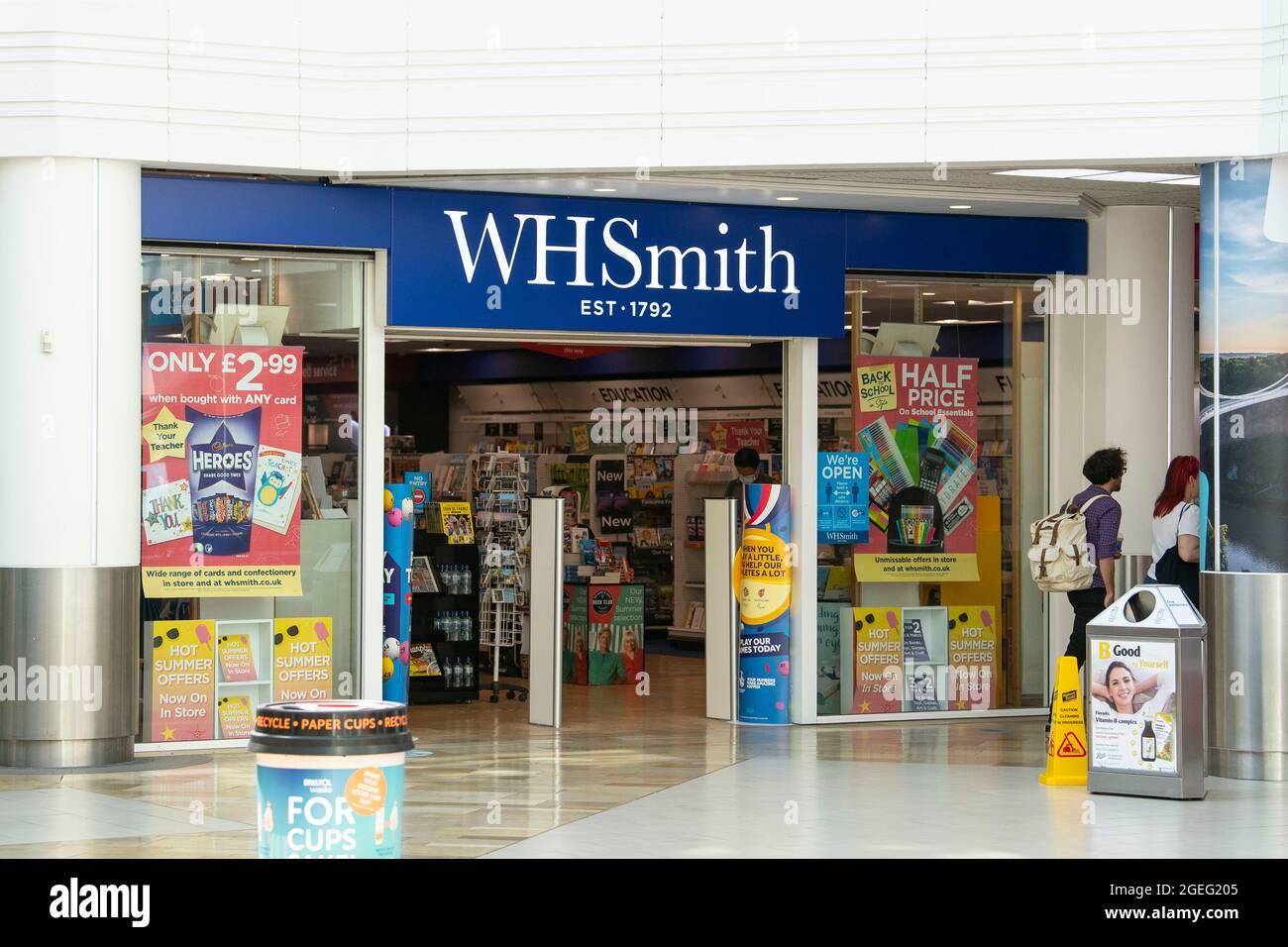 People wearing masks shopping at a WHSmith store in Broadmead shopping ...