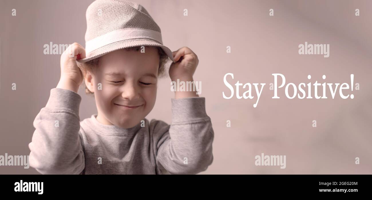 Happy child proves its positivity and felicity Stock Photo - Alamy
