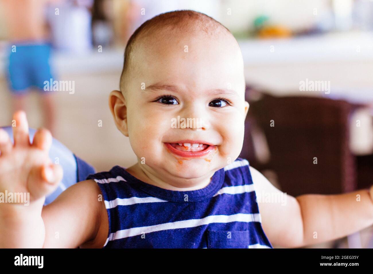 Happy little baby boy with dirty face in the restaurant at hotel ... Happy little baby boy with dirty face in the restaurant at hotel ...