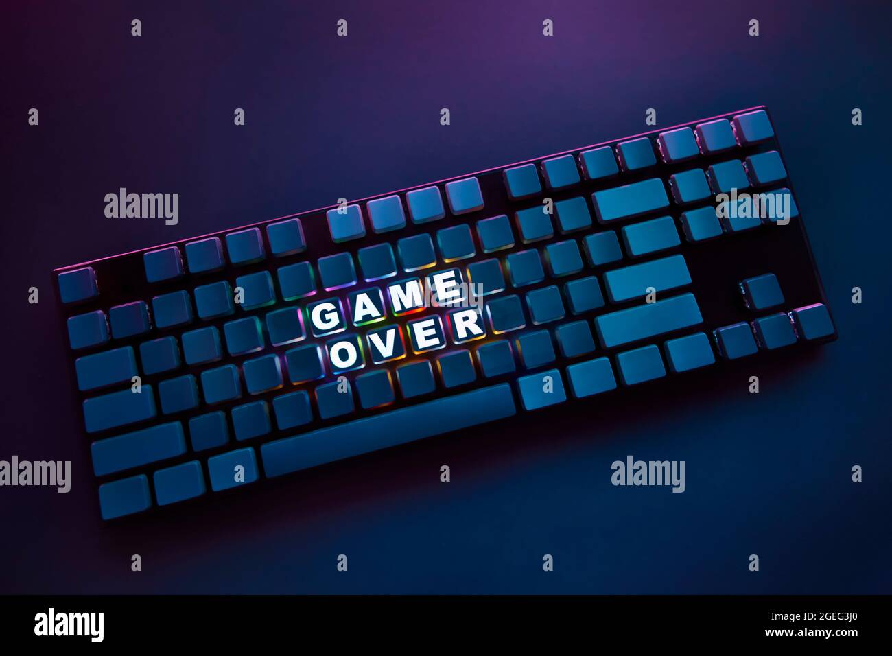 High angle view of computer keyboard with thin frame and backlighted ...