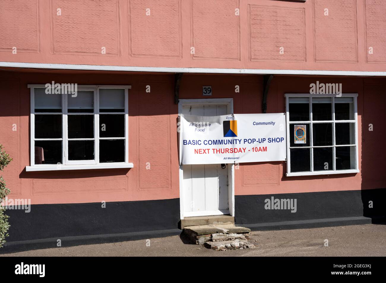 Basic community Pop-Up shop sign Stock Photo - Alamy