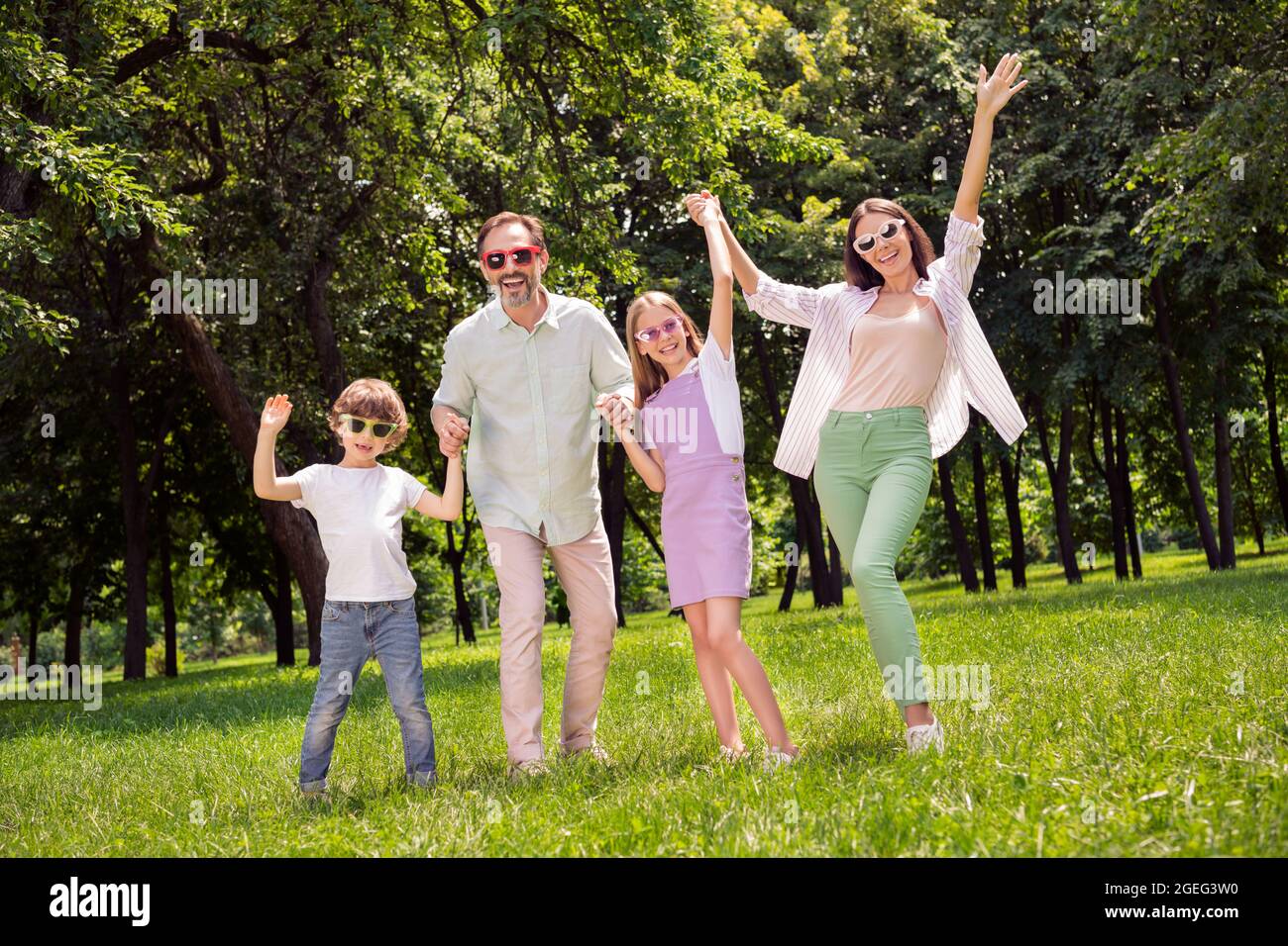 Full length body size view of attractive cheerful carefree family ...