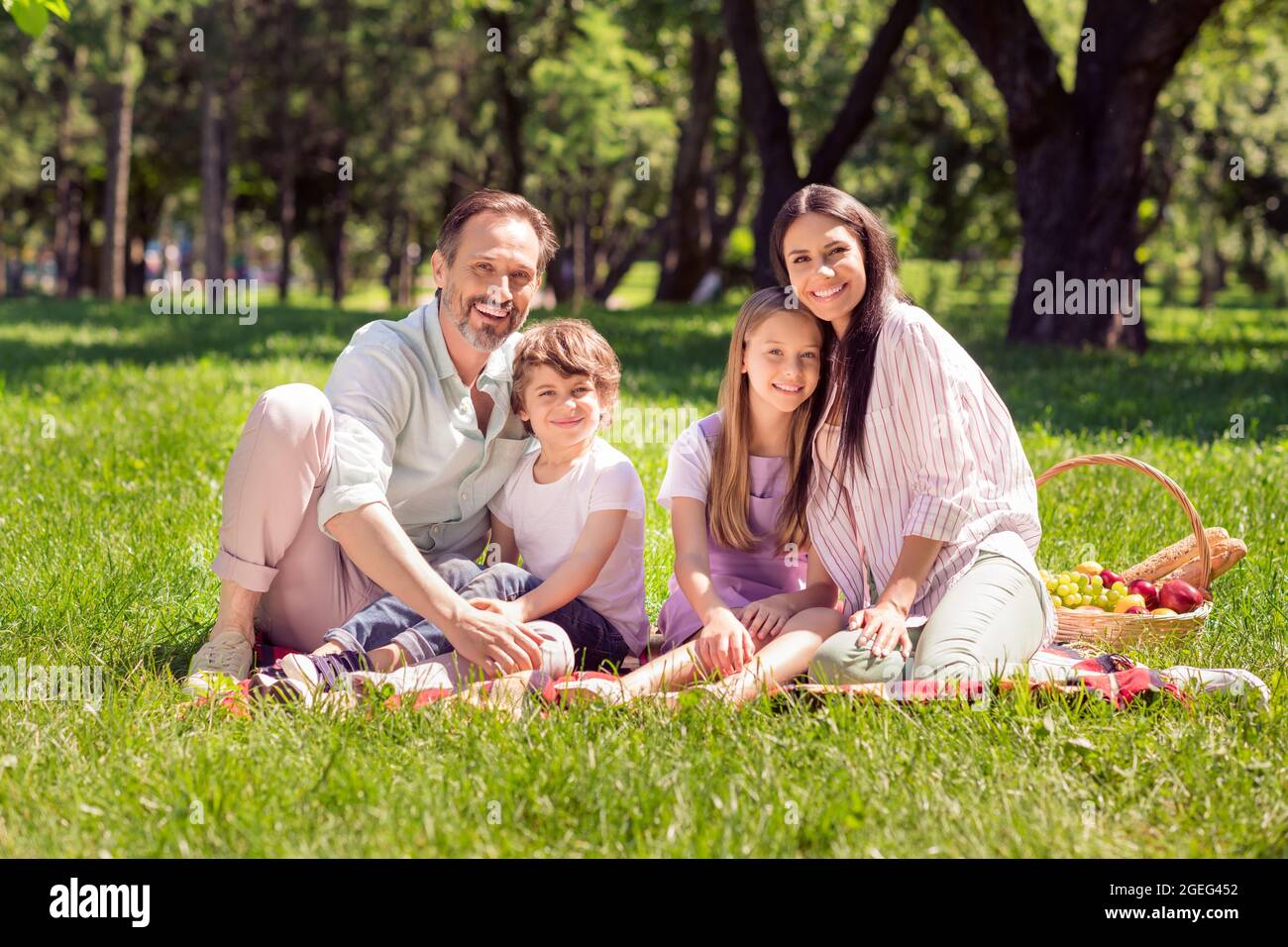 Photo of sweet funny father mother school girl boy wear casual clothes ...