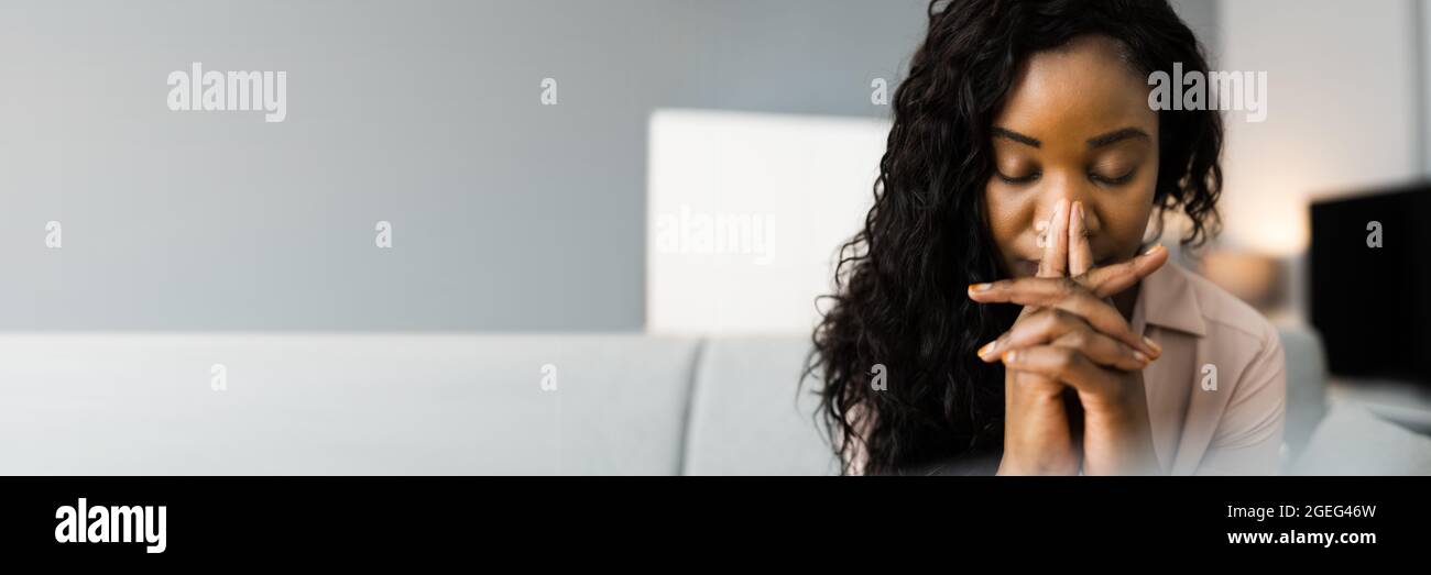 African woman praying hi-res stock photography and images - Alamy