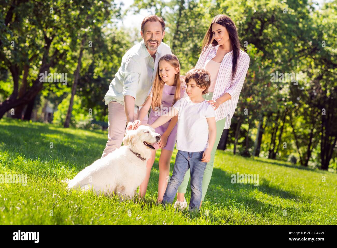 Photo of sweet charming preteen boy girl mother father dressed casual ...