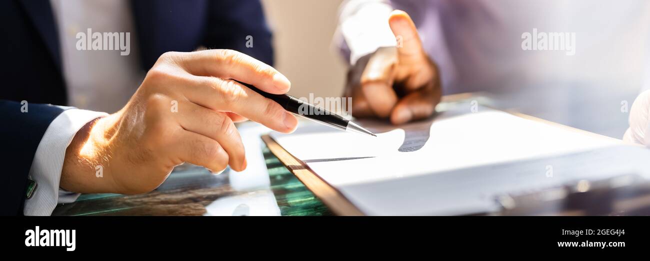 Two people signing business contract hi-res stock photography and ...