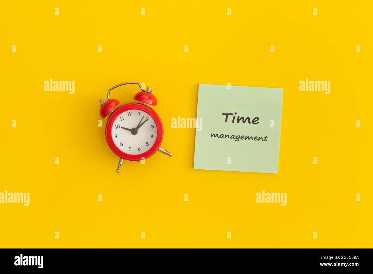 Alarm clock with time management concept Stock Photo - Alamy