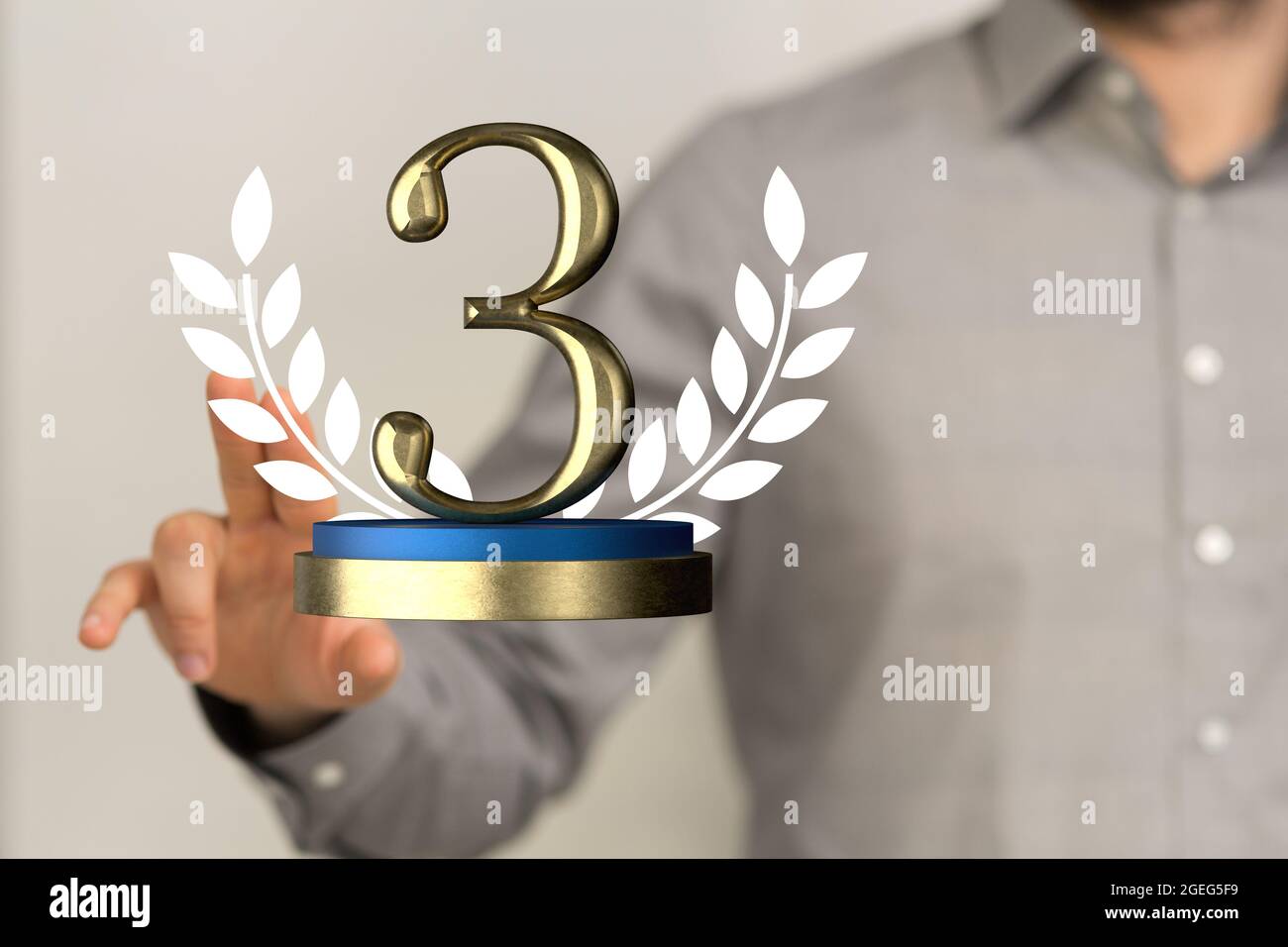 Hand holding a 3D render of a third place trophy Stock Photo - Alamy