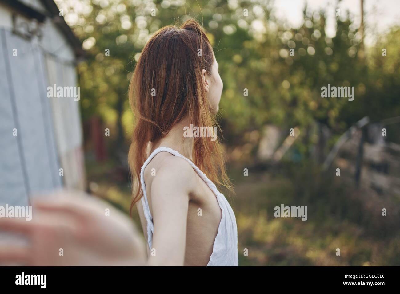 woman in white dress outdoor fun Sun freedom Stock Photo - Alamy