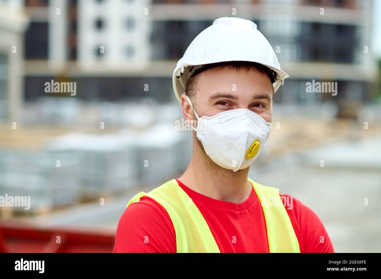 Construction worker in a safety helmet posing for the camera Stock ...