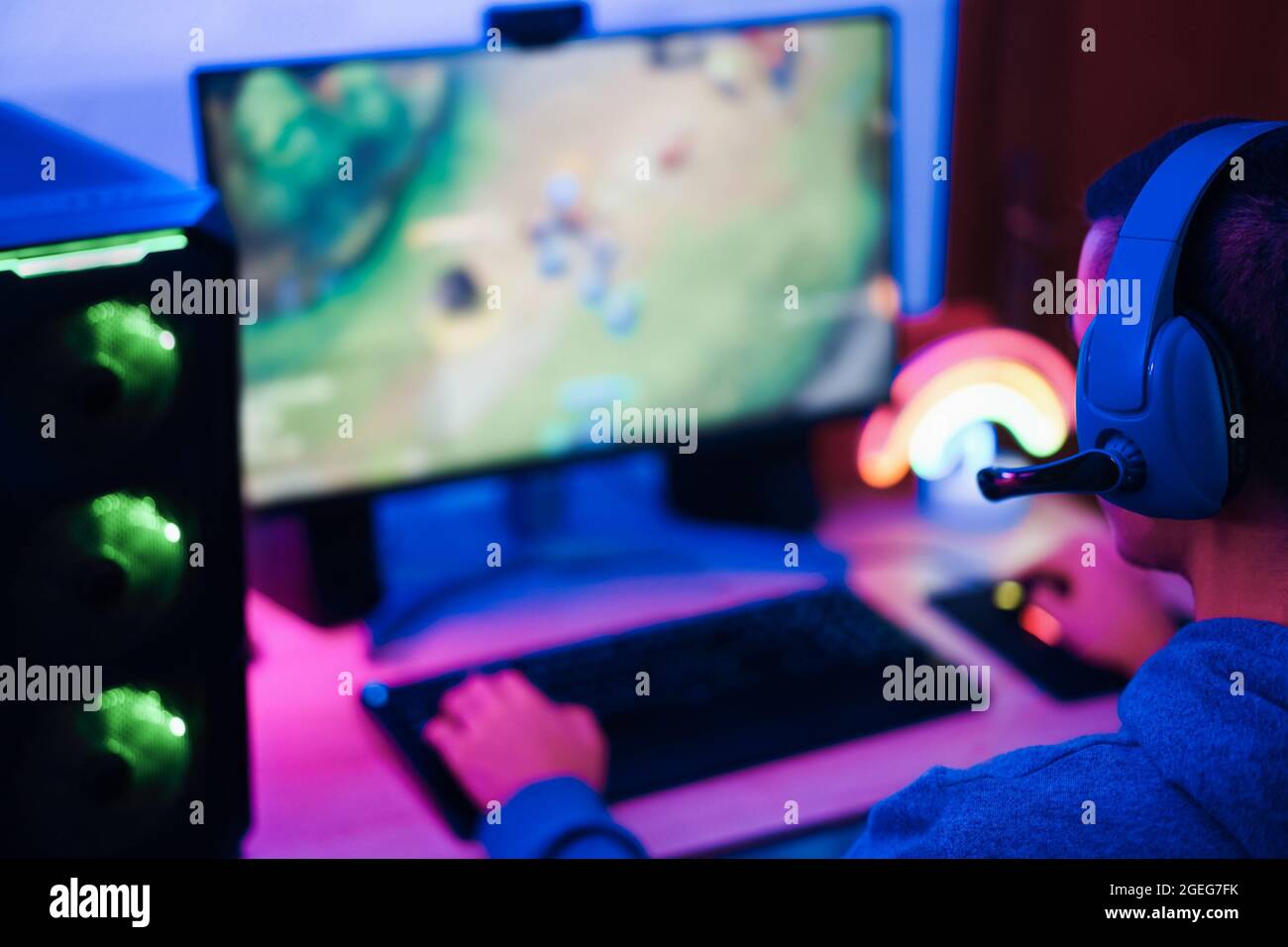 Young gamer playing at strategy game online using virtual reality ...