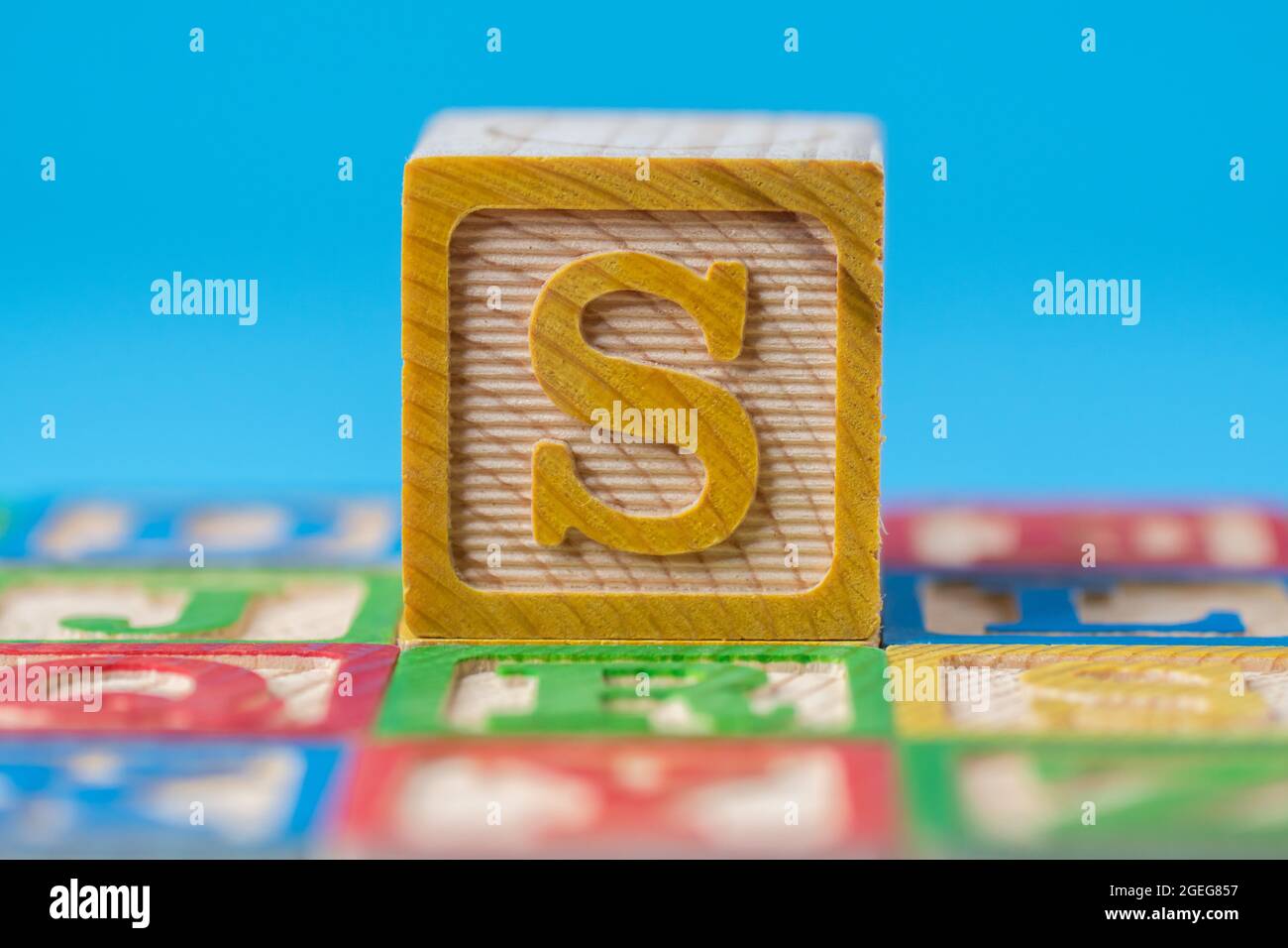 Closeup shot of an education alphabet ABC wooden block with the letter ...