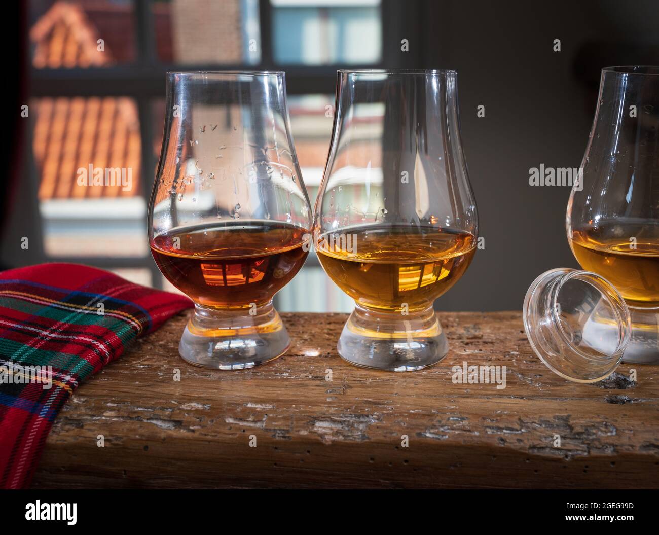 Dram of single malt scotch whisky served in tasting glass with view on ...