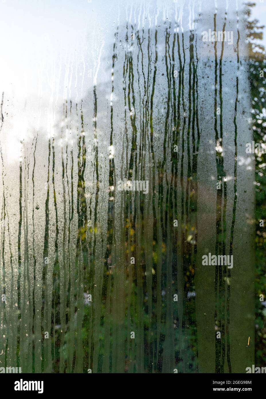 abstract photography with wet and sweaty window, raindrop texture ...