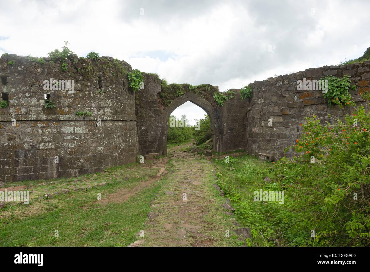 Old fallen entry gate of Dhodap fort, Nashik, Maharashtra, India Stock ...
