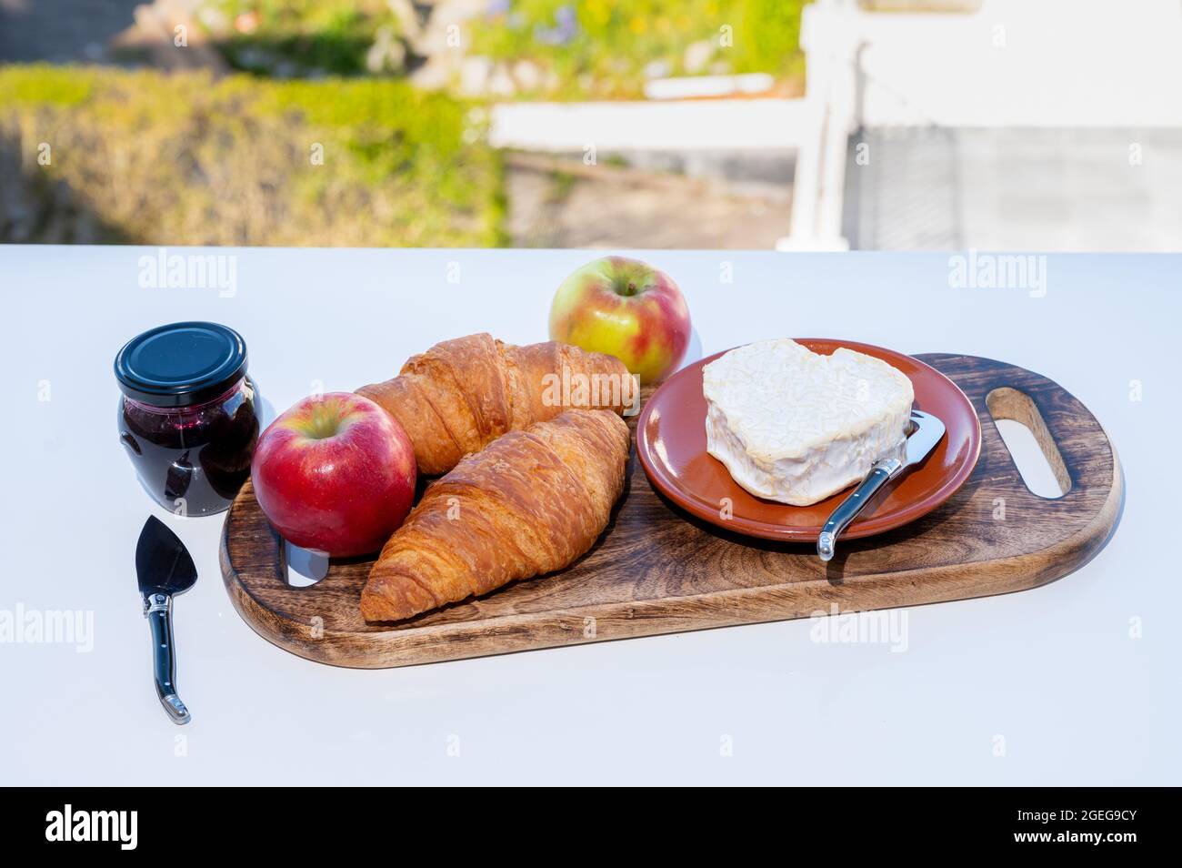 French breakfast with fresh baked croissants and cheeses from Normandy ...