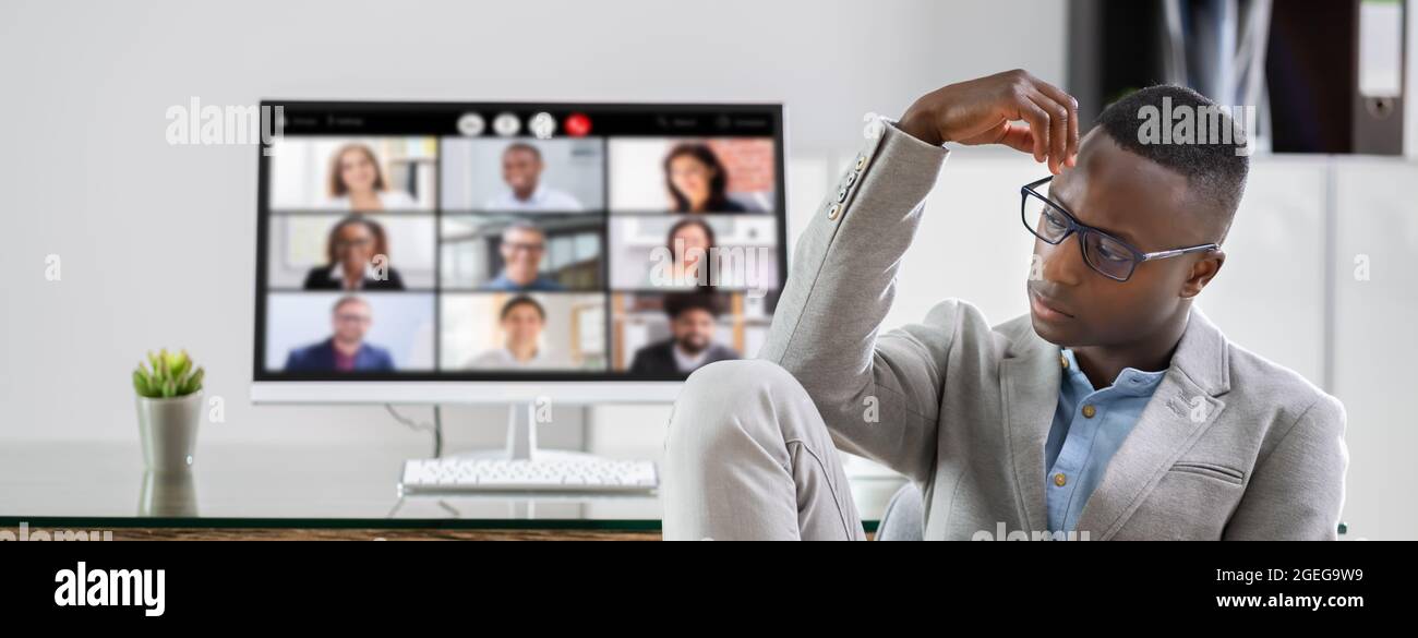 Bored Employee In Video Conference Training Meeting Stock Photo - Alamy