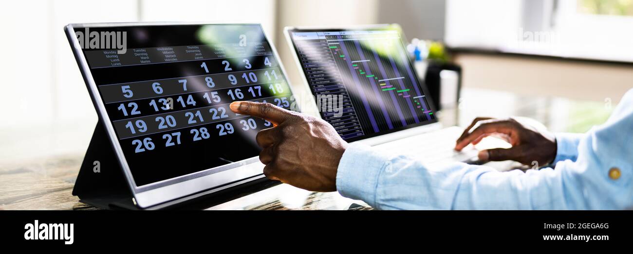 Gantt Chart Calendar Schedule On Multiple Laptop Computers Stock Photo ...