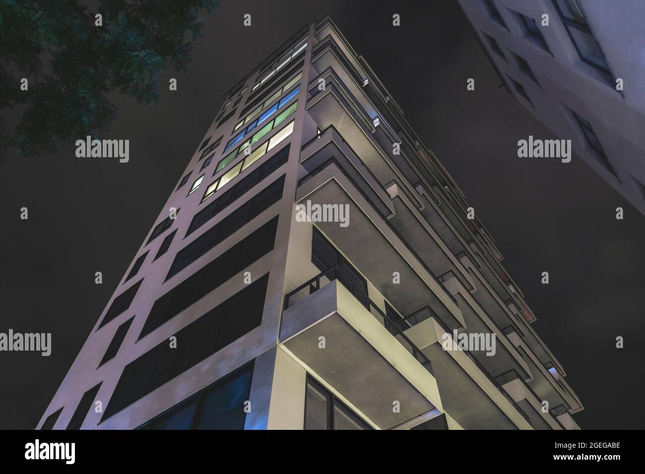 Bottom view of modern high residential house at night. Luxury ...