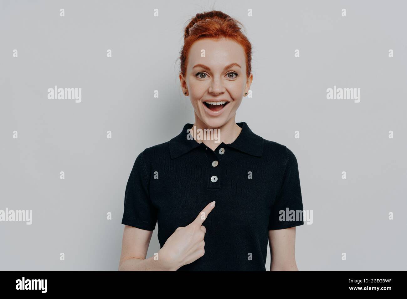 Young excited overjoyed ginger female being mentioned or being choosen ...