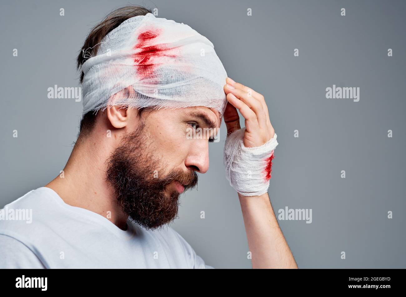 patient bandaged head and hand blood isolated background Stock Photo ...