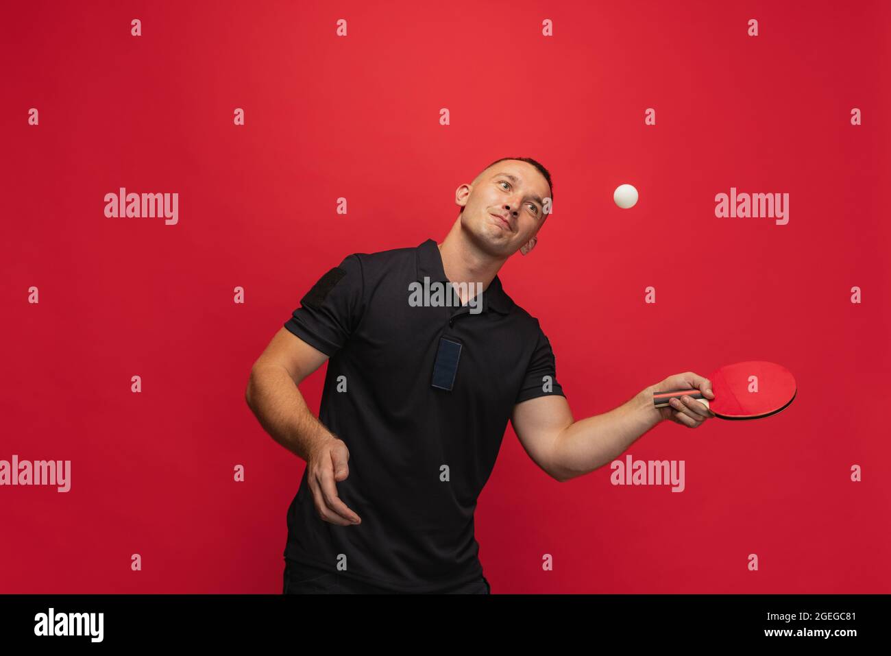 One young caucasian man with ping pong racket playing table tennis over ...