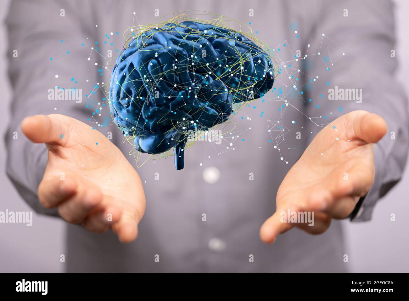 Male's hands holding an illustrated blue human brain Stock Photo - Alamy