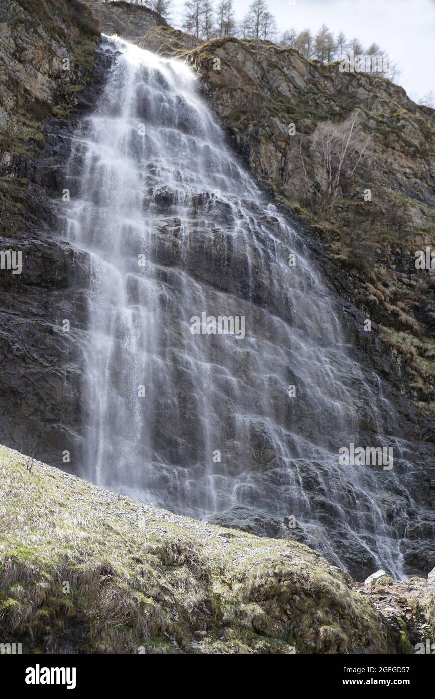 tall waterfall along sheer cliff Stock Photo - Alamy
